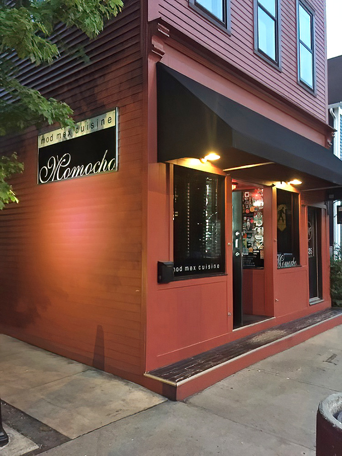 As evening falls, Momocho's storefront glows with promise, like that friend who always knows where the good times are happening.