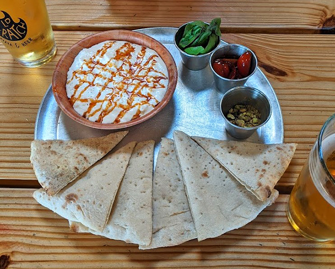 The stracciatella arrives like a deconstructed dream&mdash;creamy cheese, warm flatbread, and accompaniments that let you build each perfect bite to your specifications.