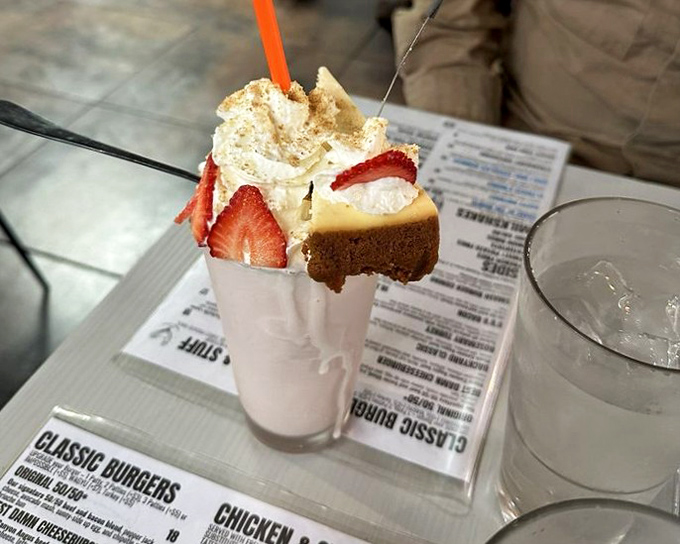Not just a milkshake, but a dessert skyscraper with strawberry and cheesecake playing the starring roles. Drinking it is optional; photographing it is mandatory.