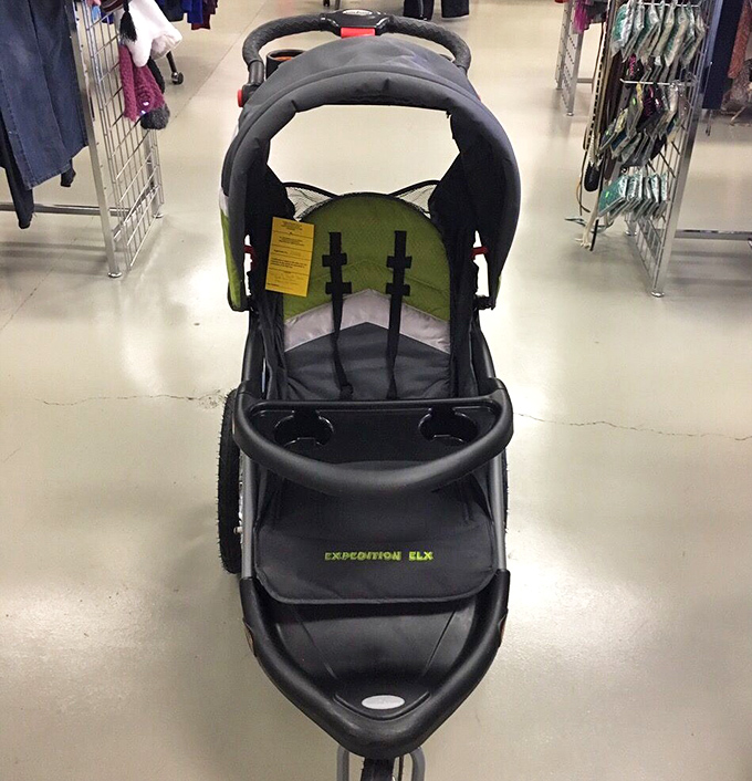 A lonely stroller awaits its next tiny passenger and their collection of mysteriously sticky treasures.