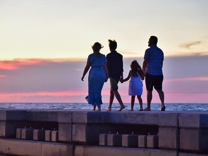 Sunset strolls: The nightly show that turns ordinary families into silhouettes against nature's most spectacular canvas&mdash;no tickets required.