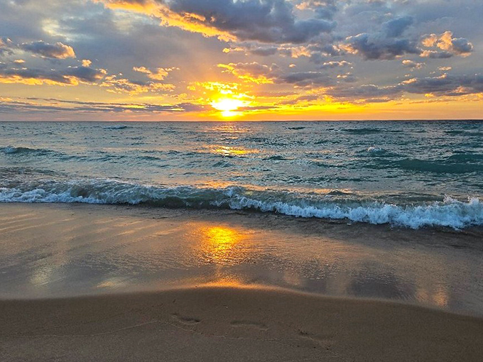 Lake Michigan sunset: when the sky and water compete for who can display the most spectacular colors. Nature's version of a standing ovation at day's end.