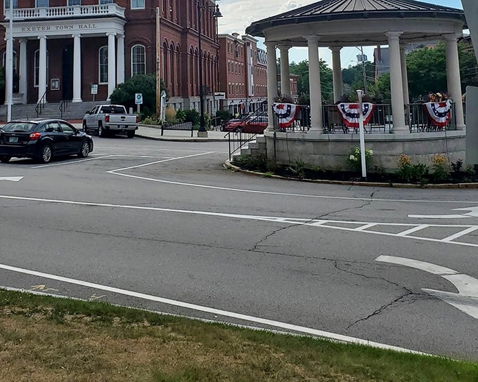Exeter Town Hall and the Swasey Pavilion frame the town's central intersection, civic landmarks that have witnessed centuries of community life.