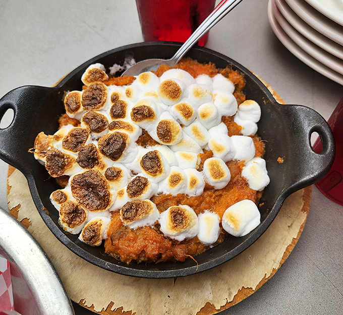 Sweet potato casserole with toasted marshmallows that blurs the line between side dish and dessert. Nobody's complaining.