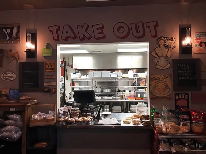 The take-out window&mdash;where hope begins for those bringing Hood's magic home. That vintage-inspired wall art reminds us that good food has always been worth the wait.