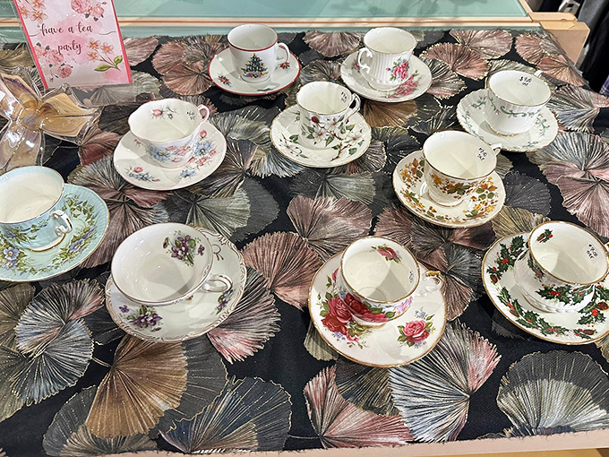 Delicate teacups arranged like a royal garden party, just waiting for your pinky to extend in afternoon elegance.
