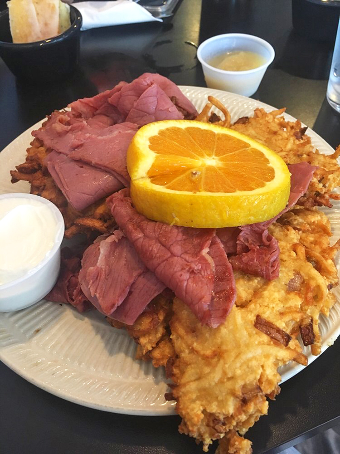 The Schmoozer isn't just a sandwich&mdash;it's a monument to excess, where corned beef lounges atop crispy potato pancakes like it's on vacation.