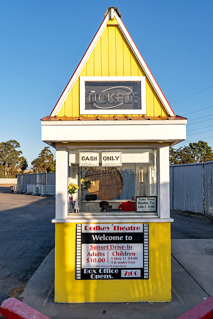 The iconic ticket booth window frames countless date nights, family outings, and first-time adventures in outdoor cinema.