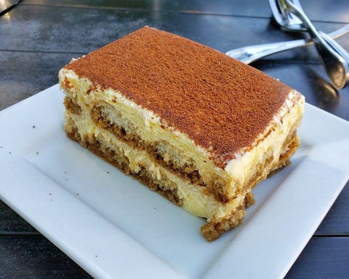 This isn't tiramisu&mdash;it's galaktoboureko's sophisticated cousin, layers of custard and soaked cake dusted with cinnamon that demands to be savored slowly.