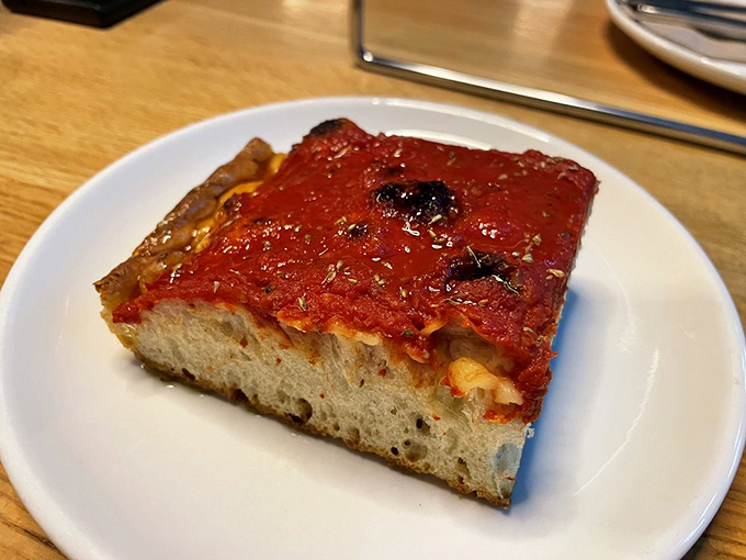 The tomato pie square&mdash;thick, focaccia-like, and unapologetically saucy&mdash;proves that great pizza doesn't always need to be round.