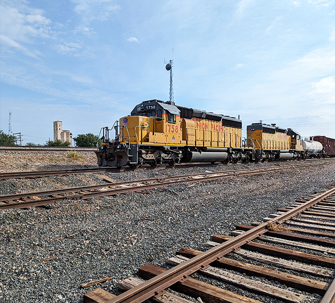 Union Pacific's mighty yellow locomotives rumble through Abilene, connecting this West Texas gem to the nation's rail network with powerful diesel determination.