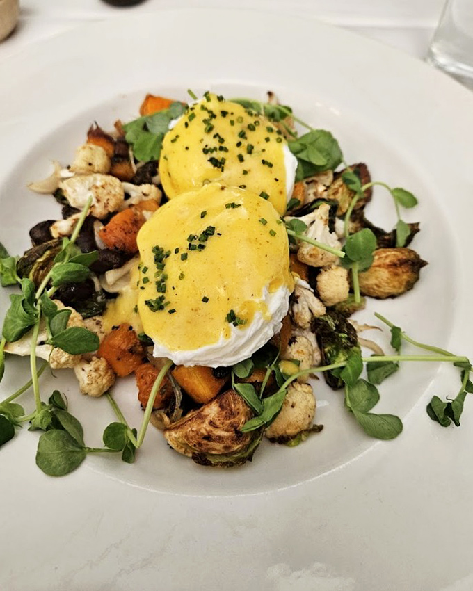 Poached eggs crown this vegetable hash like royal jewels, proving that brunch at Bolete isn't just a meal &ndash; it's a weekend achievement worth documenting.