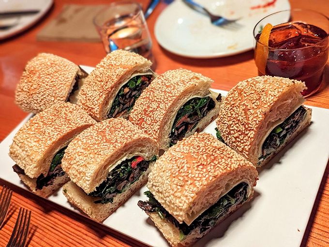 Not just a sandwich, but an architectural achievement of sesame-crusted bread, greens, and fillings. Hoagies elevated to art form.