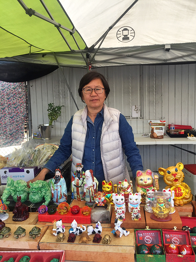 Cultural treasures and lucky charms bring international flair to the market. These smiling cats and figurines promise good fortune to those who take them home.