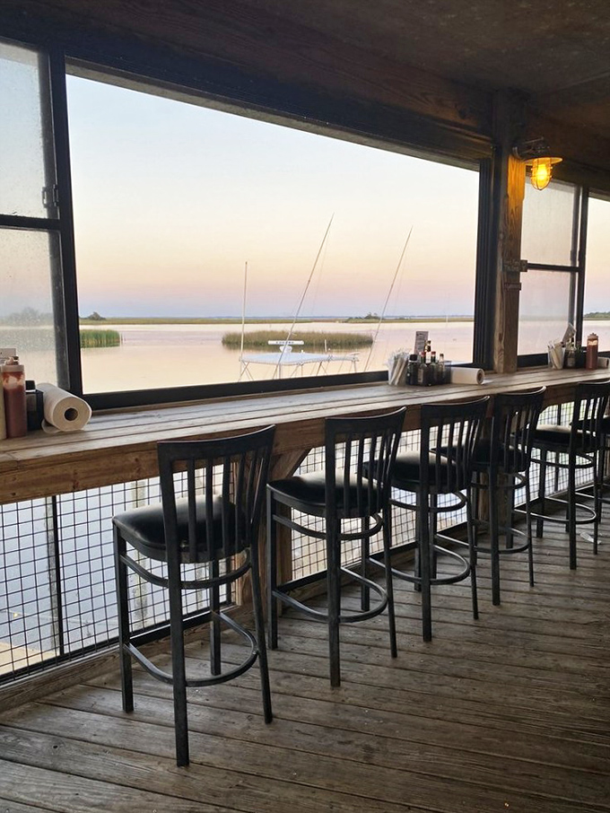 Bar stools facing the water view offer front-row seats to nature's dinner theater&mdash;sunsets and sailboats included at no extra charge.