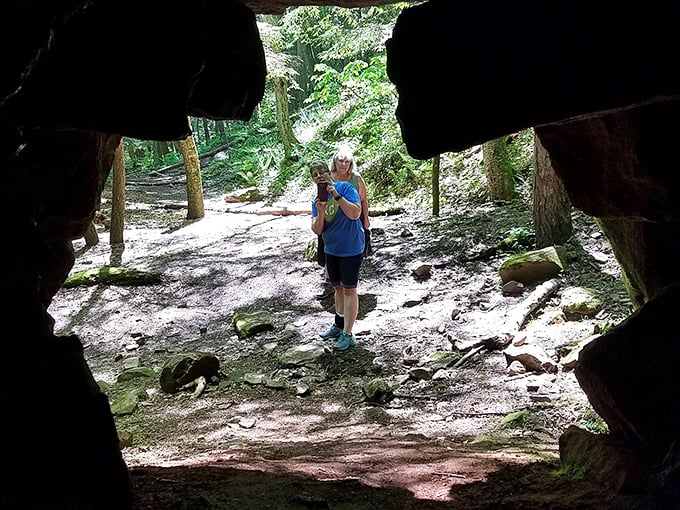 The best discoveries happen when you venture through unexpected openings. This natural stone archway frames both the path and the adventurous spirit of Pennsylvania exploration. 