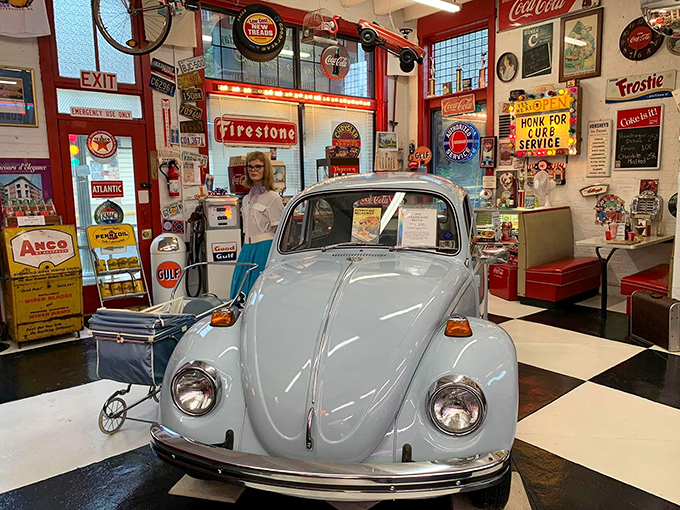 This baby-blue Beetle sits in a checkerboard wonderland of vintage signs, proving that nostalgia comes in all shapes, sizes, and countries of origin.