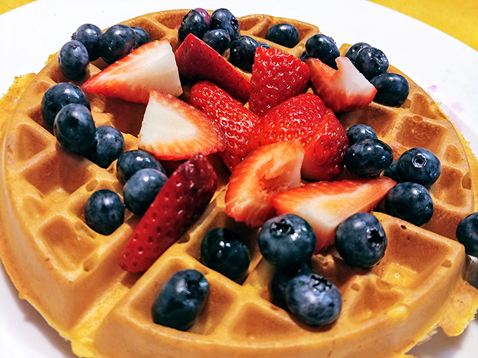 A golden waffle becomes the perfect landing pad for a squadron of blueberries and strawberries &ndash; fruit that actually tastes like fruit.
