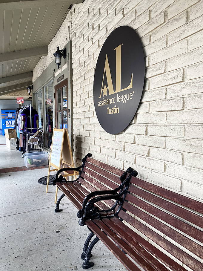 The welcoming bench beneath the Assistance League sign &ndash; the perfect spot to rest while your shopping companion "just needs five more minutes."