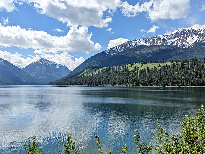 Wallowa Lake stretches between mountain sentinels like nature's perfect infinity pool. Heaven's reflection caught in Oregon's embrace.