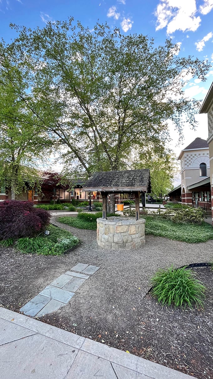 A wishing well surrounded by landscaping&mdash;toss in a penny, wish for sales, and marvel at this mall's commitment to aesthetic charm.