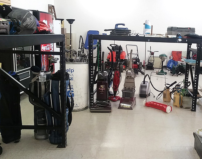 The household section where vacuum cleaners and vintage treasures mingle like an estate sale convention.