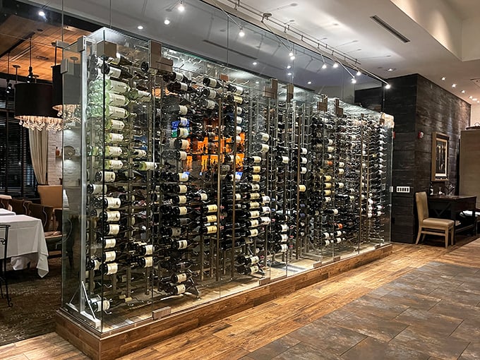 The glass-enclosed wine wall isn't just storage &ndash; it's a temperature-controlled art installation showcasing hundreds of bottles waiting for their moment.