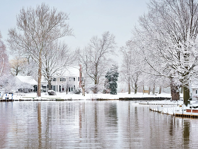 Winter transforms Vermilion's waterfront into a hushed wonderland where snow-dusted homes reflect in the still waters like a living Christmas card.