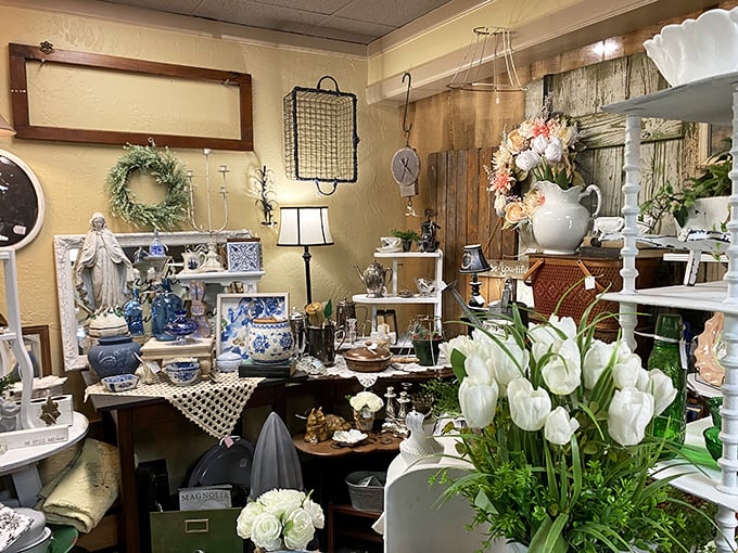 Blue and white porcelain, delicate figurines, and fresh flowers create a vignette so perfectly arranged it could make Martha Stewart reach for her wallet.