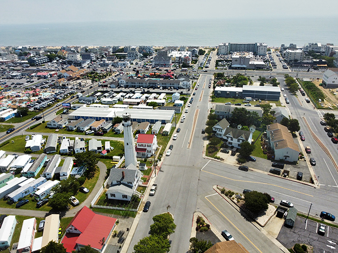 An aerial view reveals how the lighthouse stands as the crown jewel in this coastal community's architectural tiara.