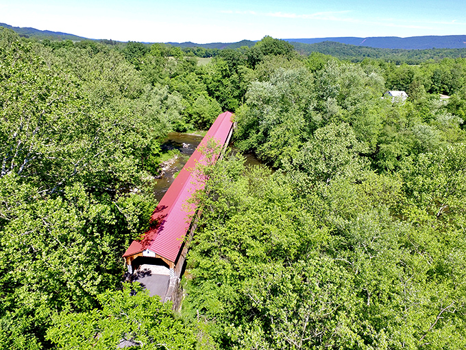 An aerial view showcases how perfectly the bridge nestles into Pennsylvania's rolling landscape, a human creation in harmony with nature.