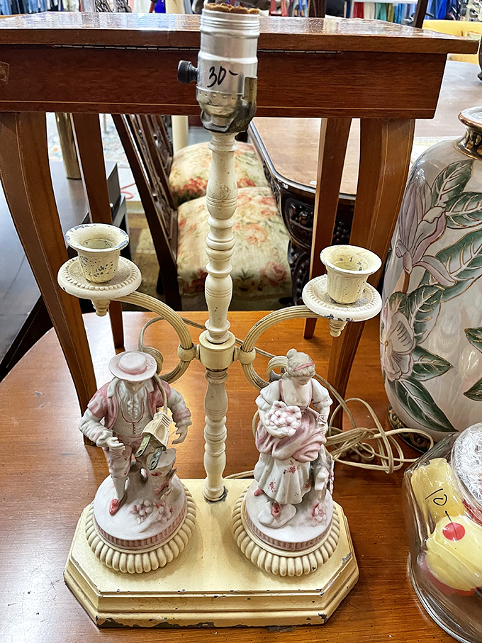 This vintage porcelain lamp featuring pastoral figures wouldn't be out of place in "Downton Abbey," yet here it sits, awaiting adoption.
