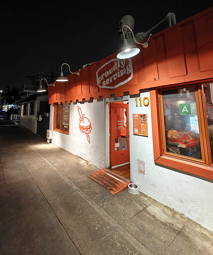 At night, Proudly Serving glows like a lighthouse for the hungry, guiding wayward souls toward smash burger salvation.
