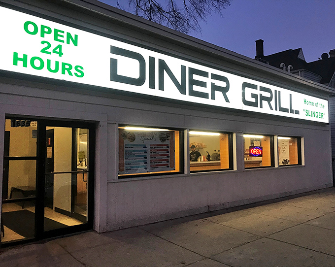 At night, the illuminated sign becomes a lighthouse for the hungry, beckoning with its 24-hour promise of comfort in a world that rarely waits.