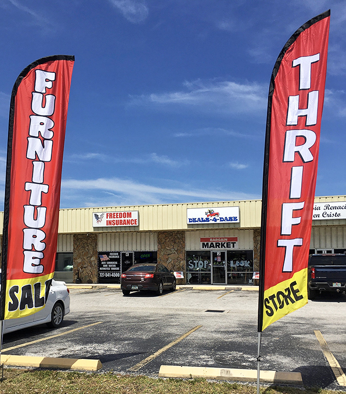 Those red "FURNITURE" and "THRIFT" flags flutter like beacons of bargain hope in the Florida breeze, calling to savvy shoppers everywhere.