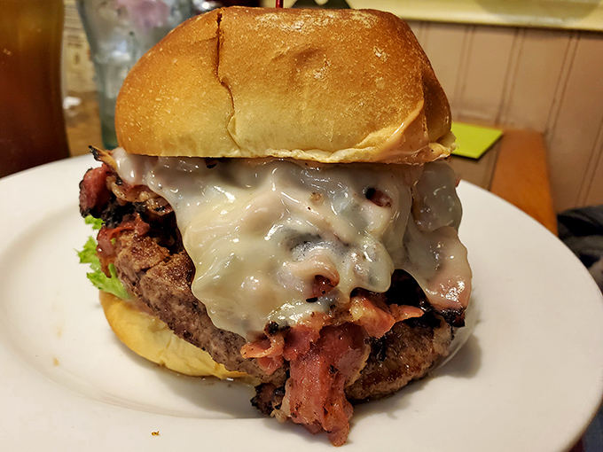 A burger so gloriously excessive it requires both hands, several napkins, and possibly a post-meal nap. Worth every delicious calorie.