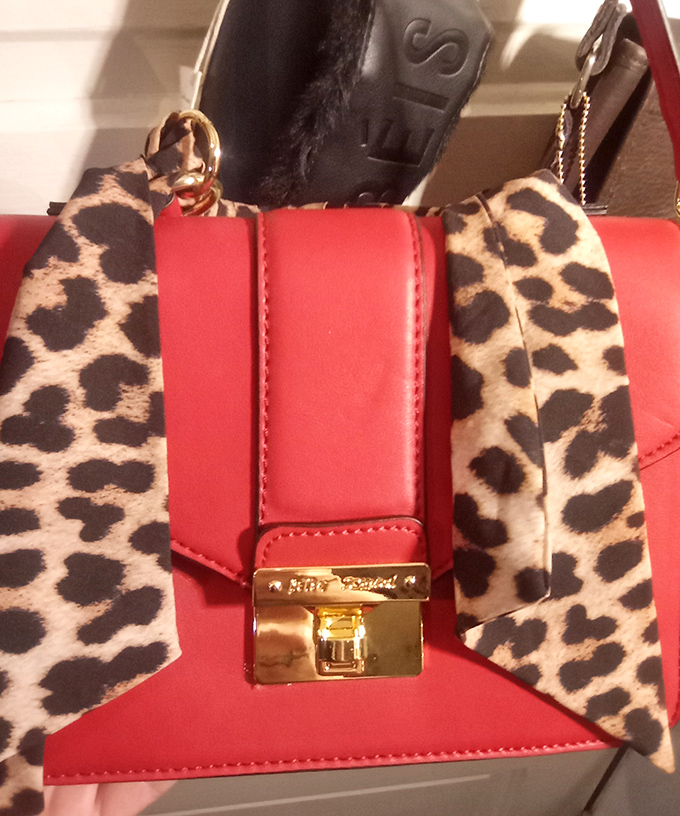 That red and leopard handbag isn't just an accessory—it's fashion courage in purse form, waiting for its perfect match.