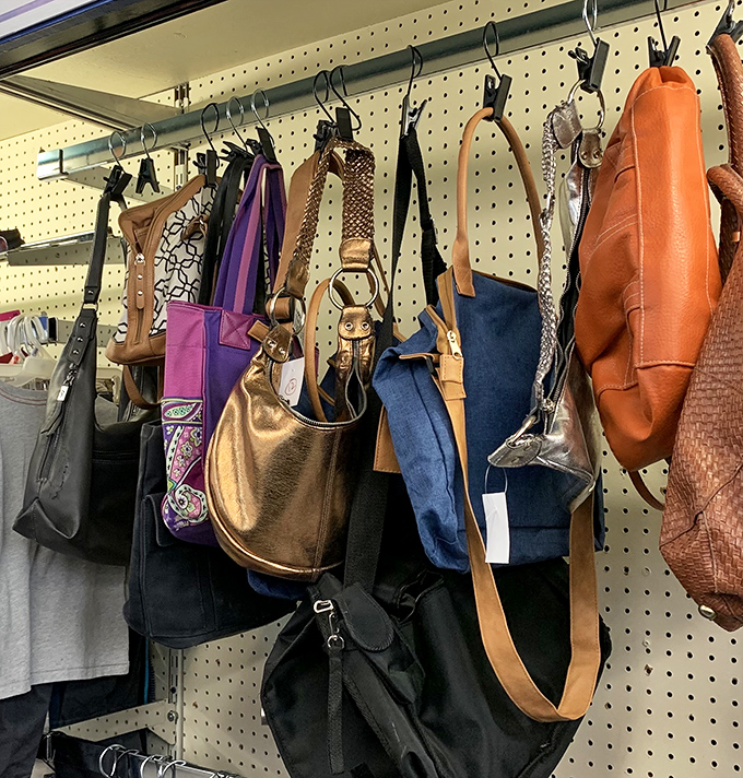 Handbag heaven hanging in perfect formation. That gold number could easily transition from grocery store to gallery opening without missing a beat.
