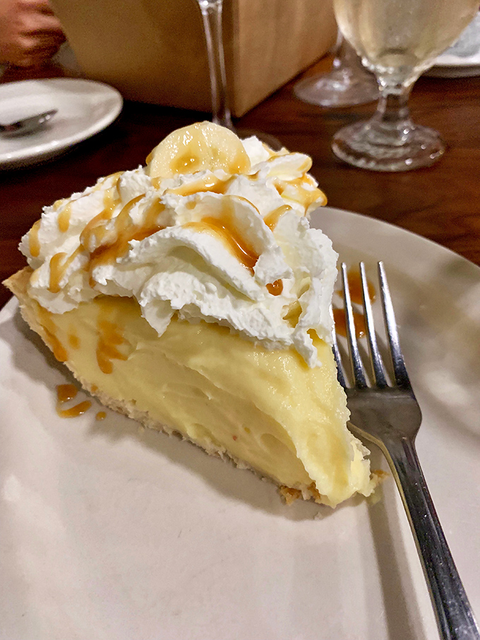 Banana cream pie that makes you consider ordering a second slice before finishing your first&mdash;cloud-like whipped cream atop custard that defies physics and willpower.