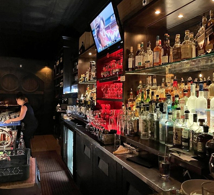 A bar stocked like an Italian grandmother's pantry—if grandma had exceptional taste in premium spirits and a flair for dramatic lighting.