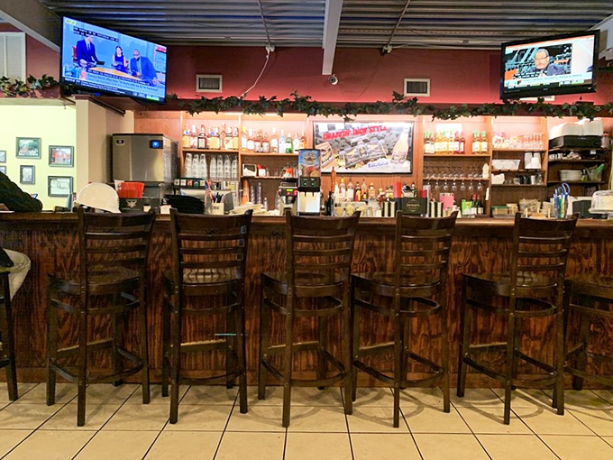 The bar area&mdash;where strangers become friends and friends become family. Wood stools that have heard it all and TVs that ensure you never miss the game.