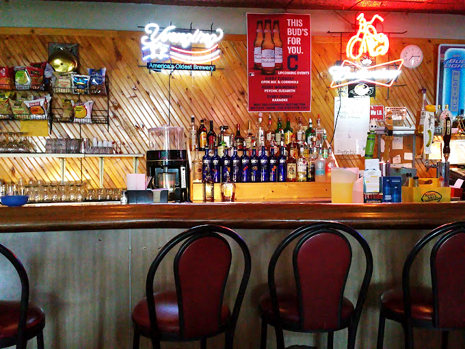 The bar where stories get better with each visit. Neon signs illuminate conversations that will continue tomorrow.