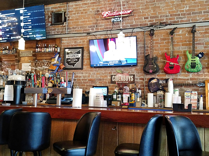 The bar area feels like the neighborhood's living room, complete with guitars on the wall and cold drinks waiting to meet your pizza.