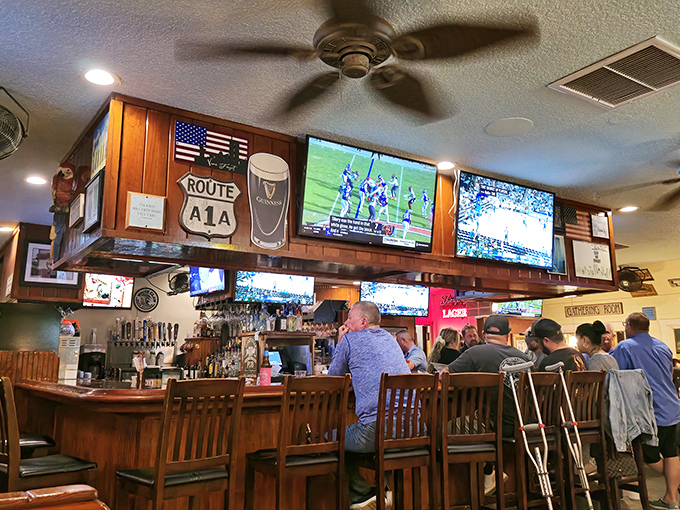 The bar area, with multiple screens and Route A1A signage, creates that perfect "neighborhood joint" feel where everyone's welcome and nobody's rushing.