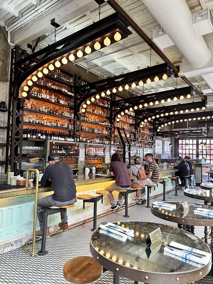 The bar at Ironside isn't just a place to wait for your table&mdash;it's a front-row seat to liquid artistry under the glow of vintage lights.