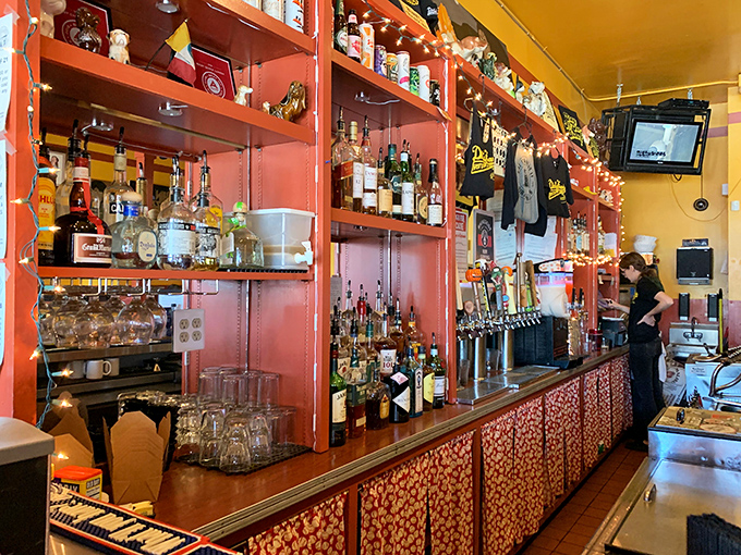 The bar at Dirty Frank's isn't just serving drinks—it's offering liquid courage for when you decide to try that hot dog topped with Sriracha and peanut butter.