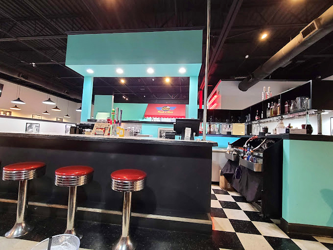 The counter seating offers a front-row view to the culinary theater&mdash;where breakfast dreams are fulfilled and diet plans go to die gloriously.