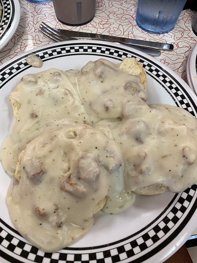Biscuits and gravy isn't just breakfast&mdash;it's edible therapy. This plate doesn't just feed your body; it soothes your soul with creamy, peppery comfort.