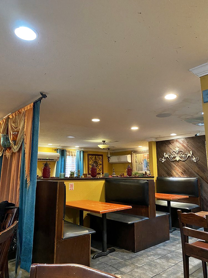 The booths at Aladdin offer that perfect blend of privacy and community&mdash;close enough to admire your neighbor's kebab plate, far enough to avoid sharing it.