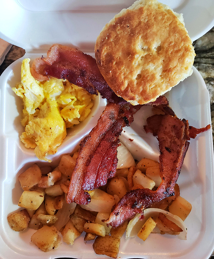 The breakfast platter that launches a thousand productive days&mdash;eggs, bacon, potatoes, and a biscuit that defies gravity.